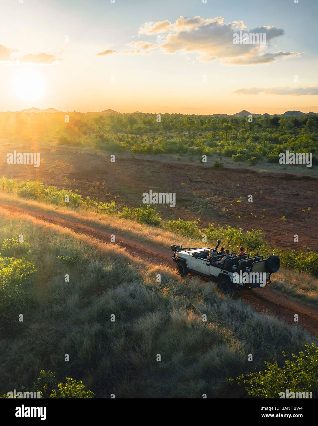 Aerial view of people during off road jeep safari at sunset, Balule ...
