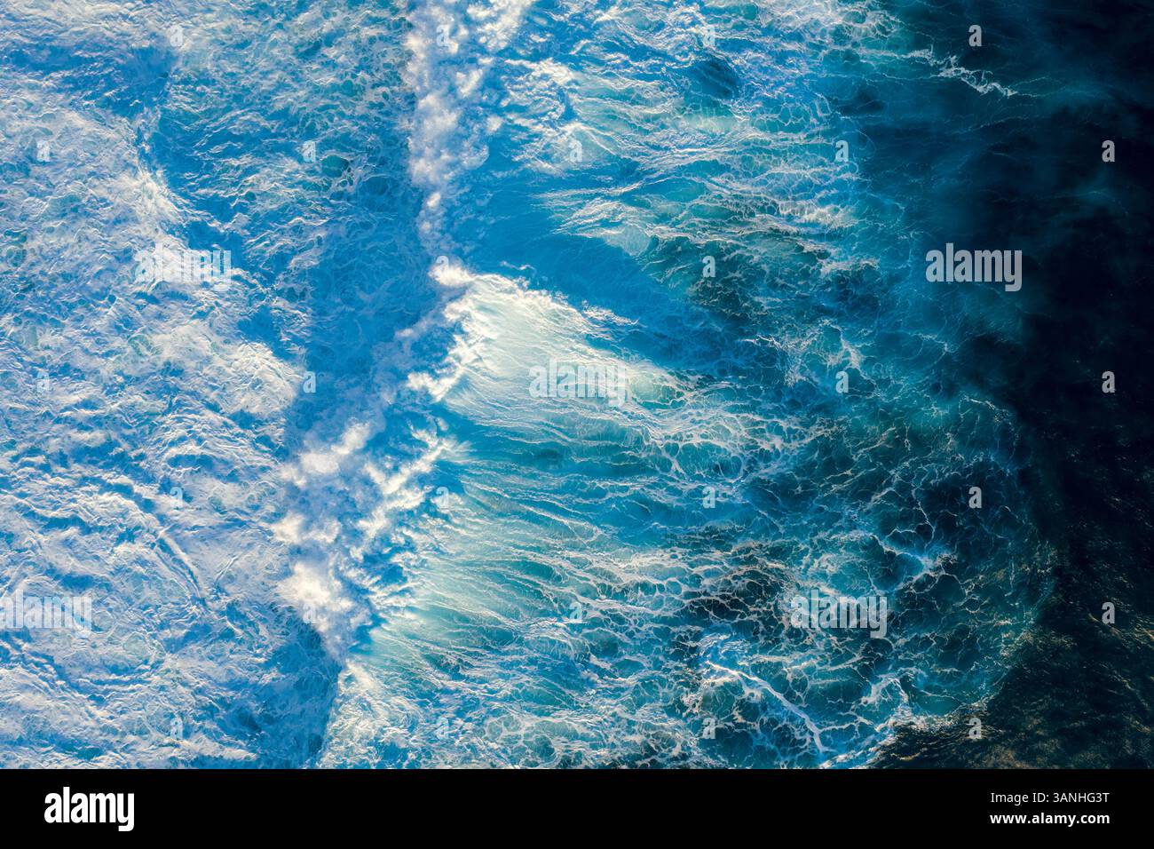 Aerial view of Indian Ocean waves breaking at Grande Anse beach ...