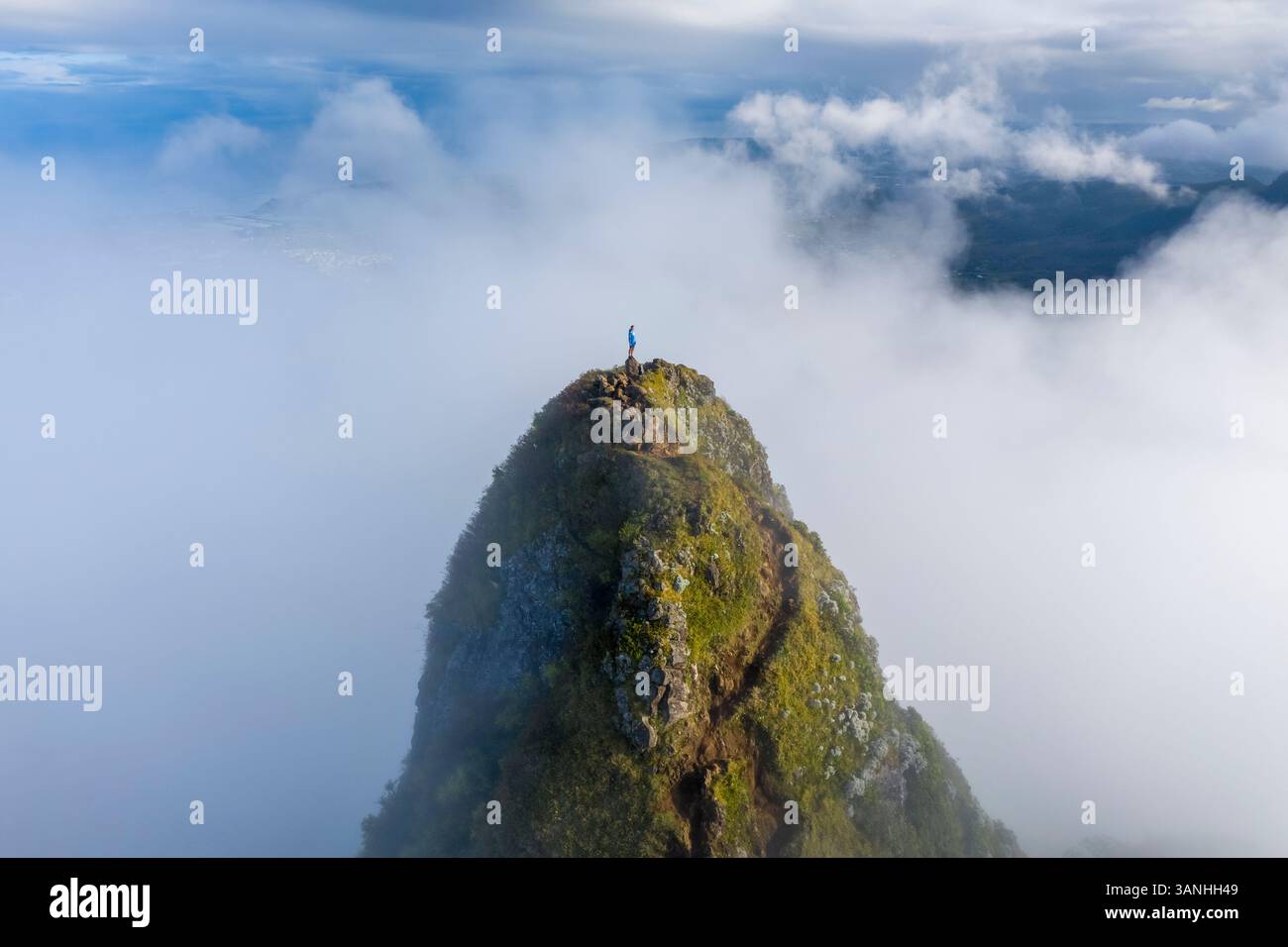 Aerial view of a person standing on Le Pouce Mountain Peak during a ...