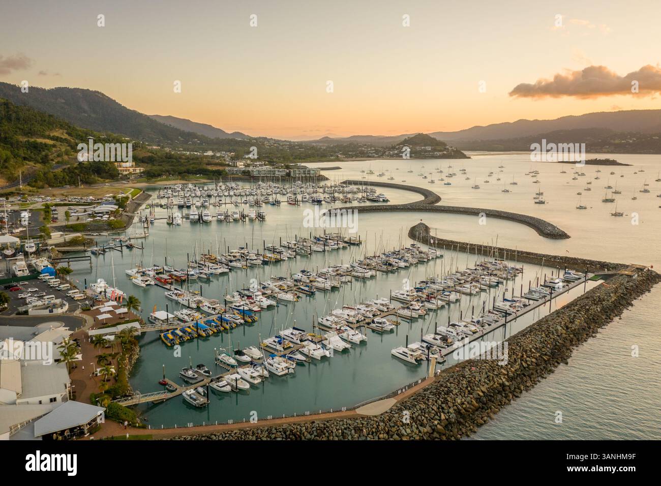 Aerial view of Cannonvale city port and harbour with breakwater ...
