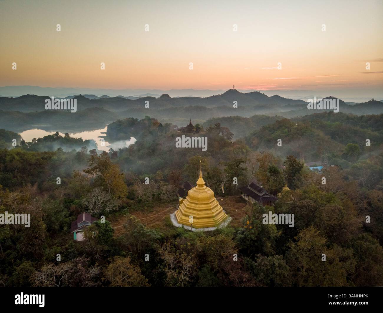 Aerial view of a small Pagoda with golden dome during a beautiful ...