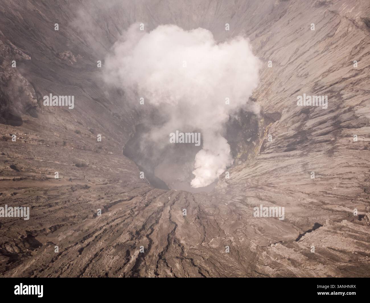 Aerial view of Mount Bromo crater releasing smoke from magma, an active ...