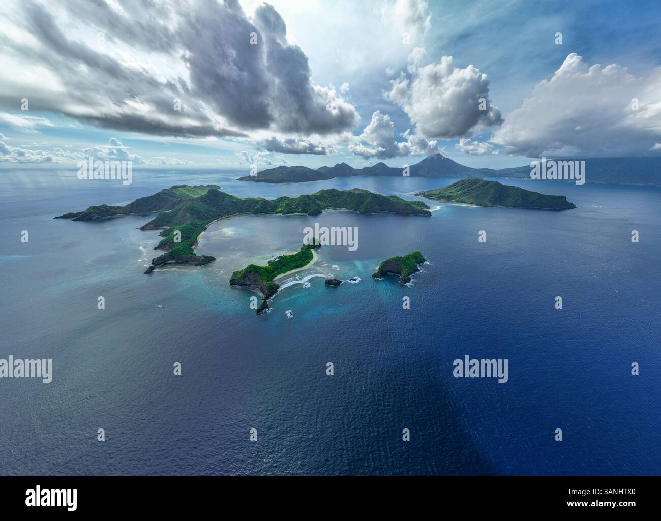 Aerial View of lush Masare and Pahepa Island with pristine beaches on a ...