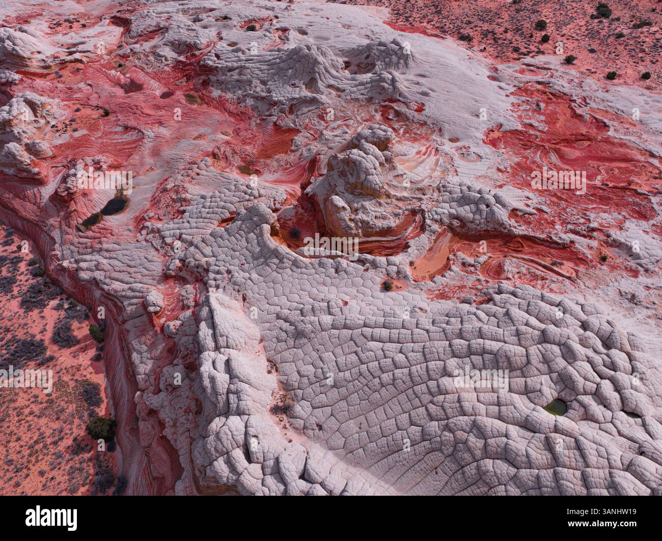 Aerial view of unique rock formations and colorful sandstone patterns ...