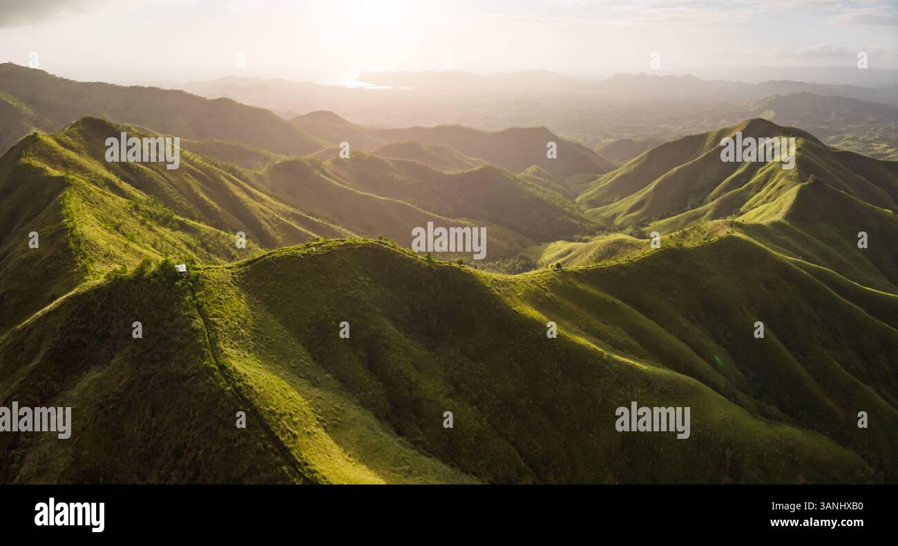 Panoramic aerial view of lush mountain ridge in the golden light of ...