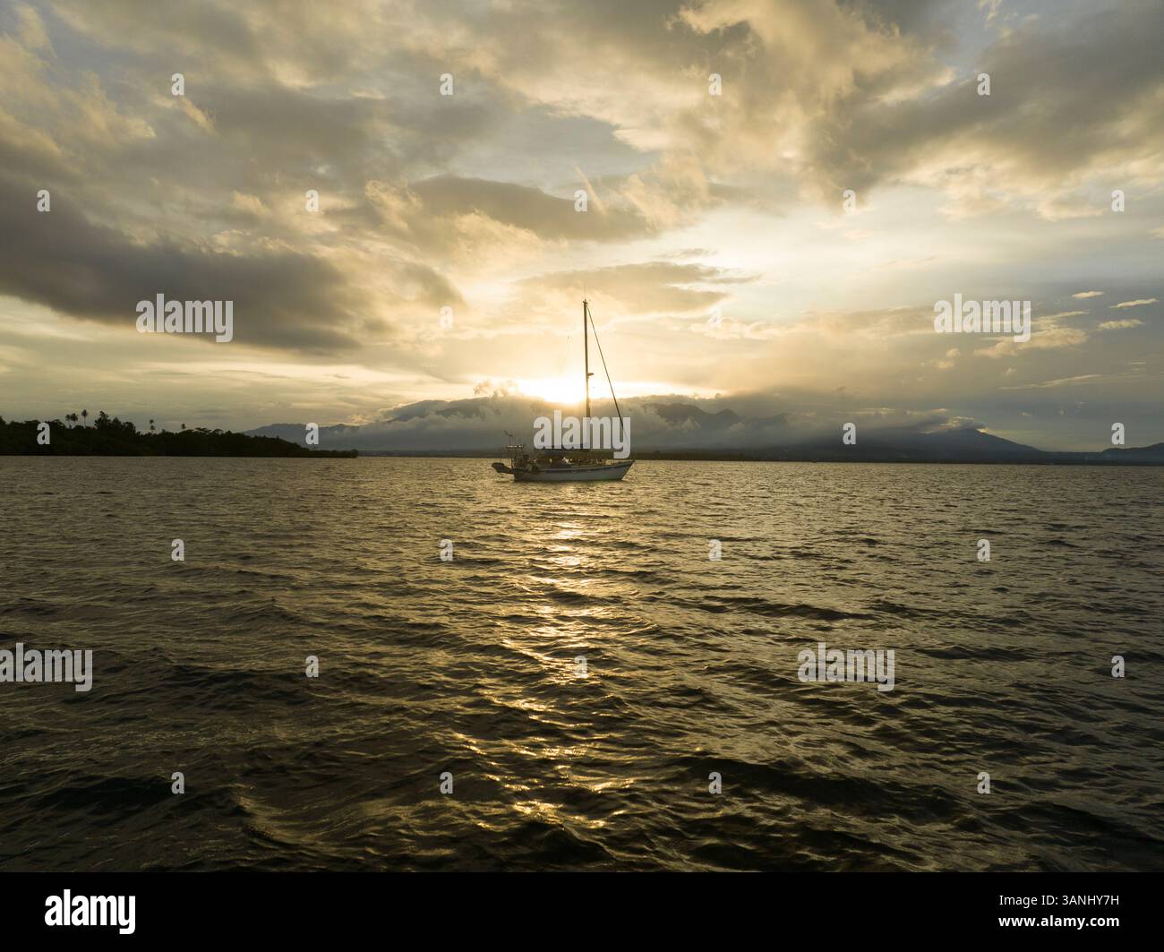 Aerial view of sailing vessels during golden hour anchoring near Tobelo ...