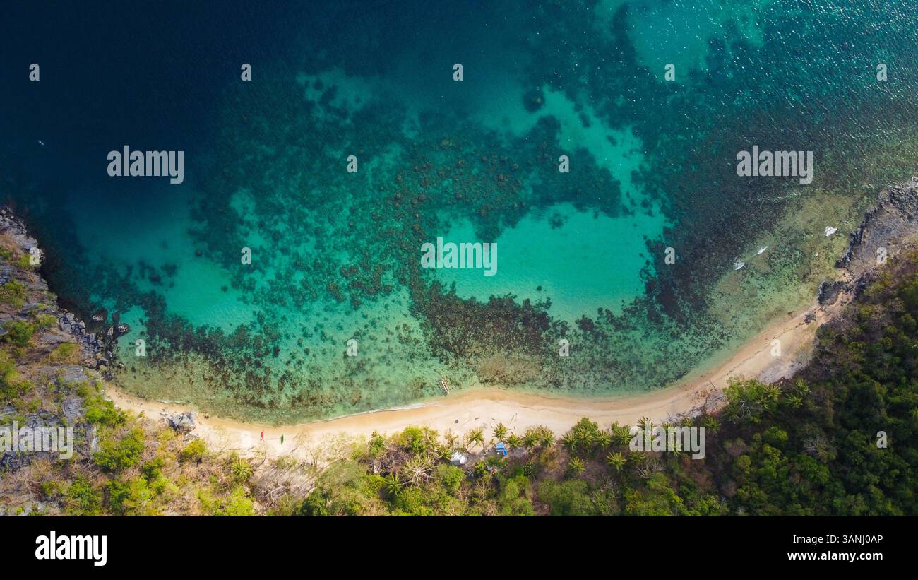 Aerial view of unnamed beach and adjoining reef on Cadlao Island, El ...