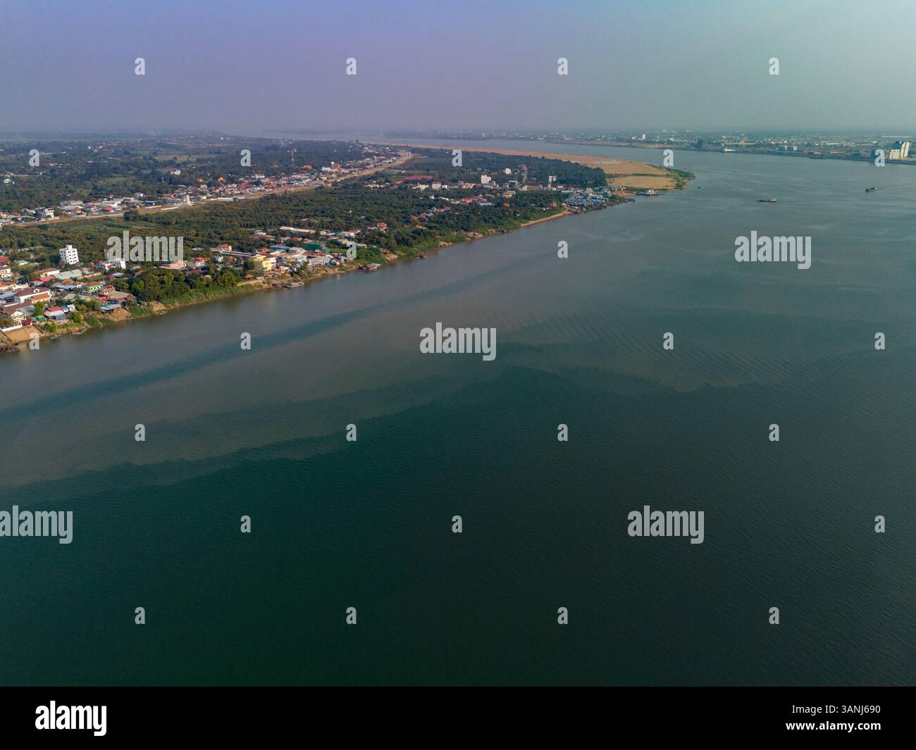 Aerial view of serene mekong and tonle sap rivers with urban landscape ...