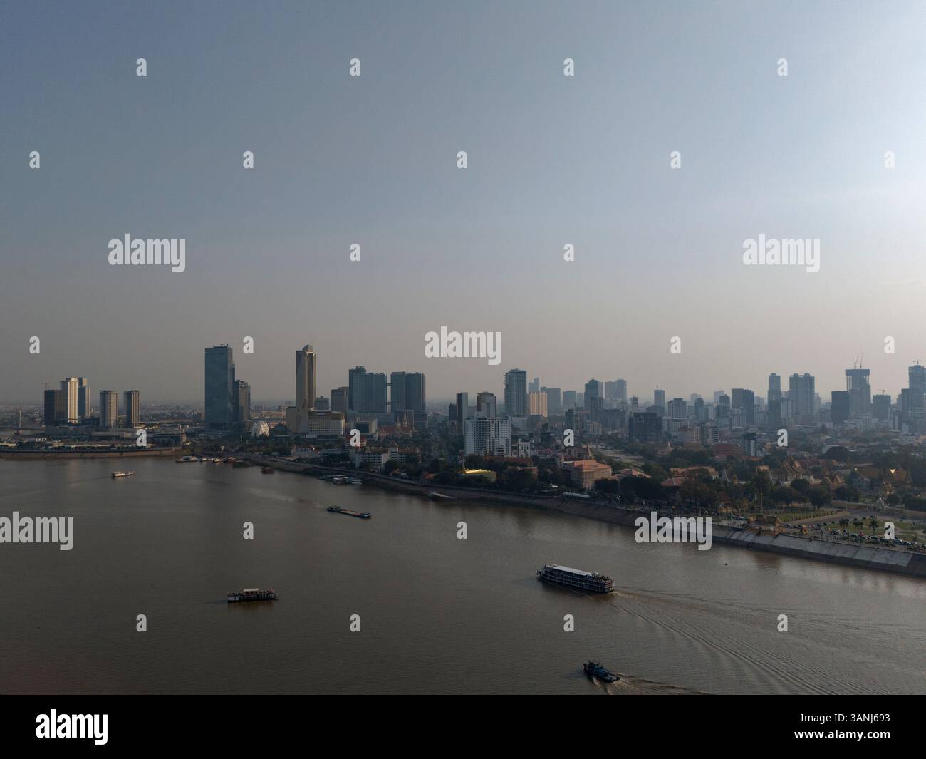 Aerial view of modern cityscape with high-rise buildings and river at ...