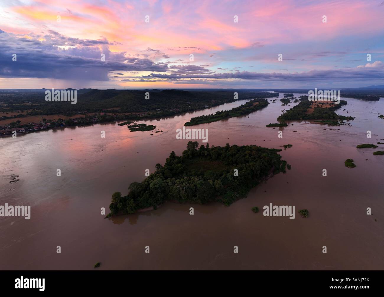 Aerial view of a tranquil river with a picturesque island under a ...