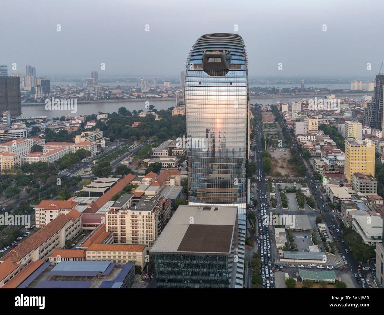Aerial view of the modern Vattanac Tower reflecting in the river amidst ...