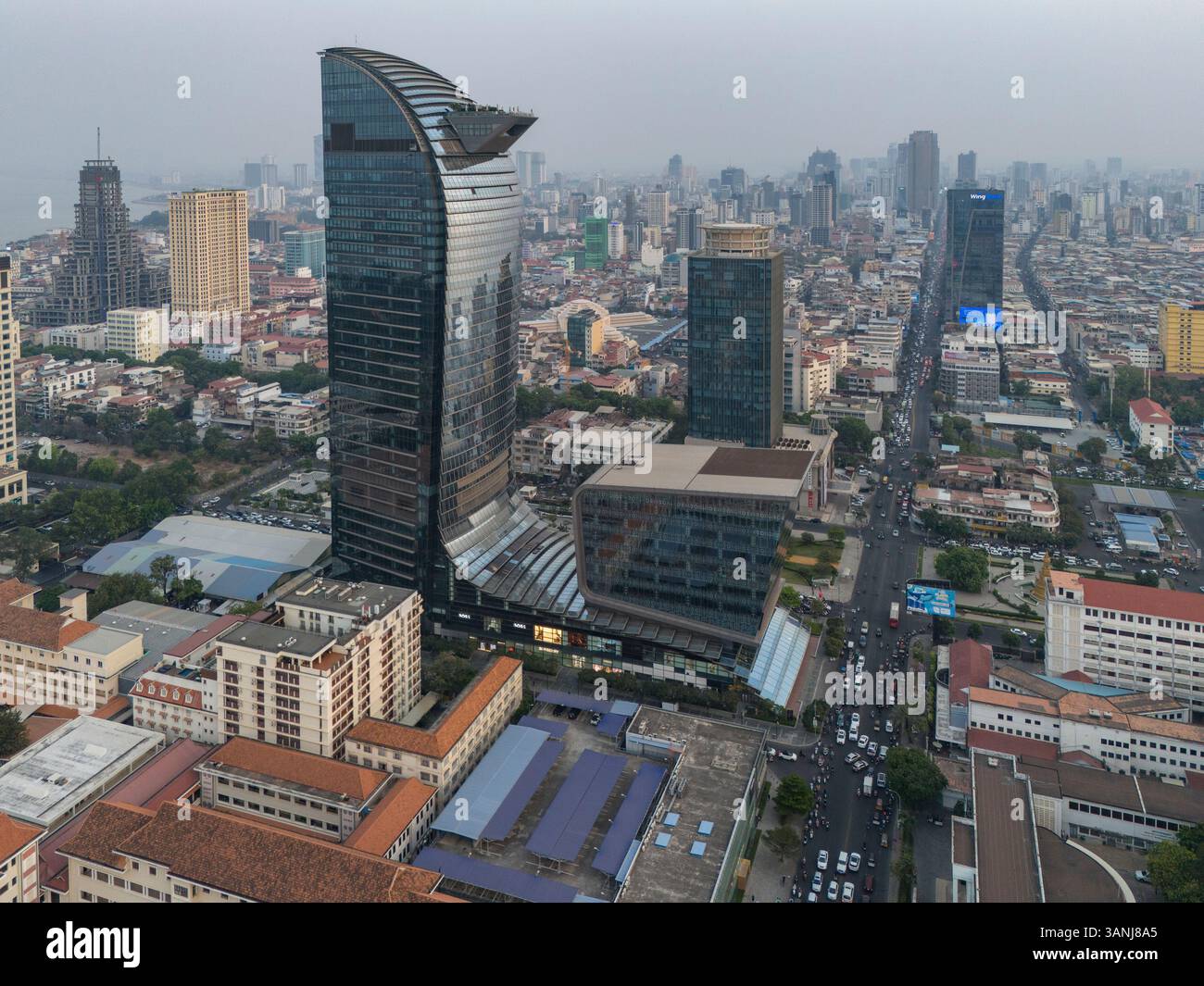 Aerial view of vattanac tower surrounded by modern buildings and bustling streets, Daun Penh ...