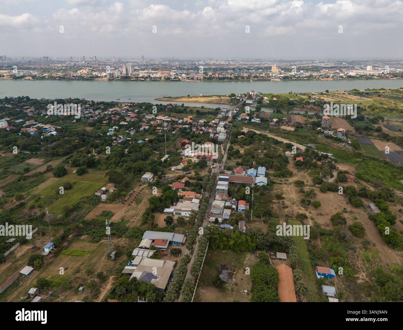 Aerial view of a scenic rural village with houses and fields along a ...