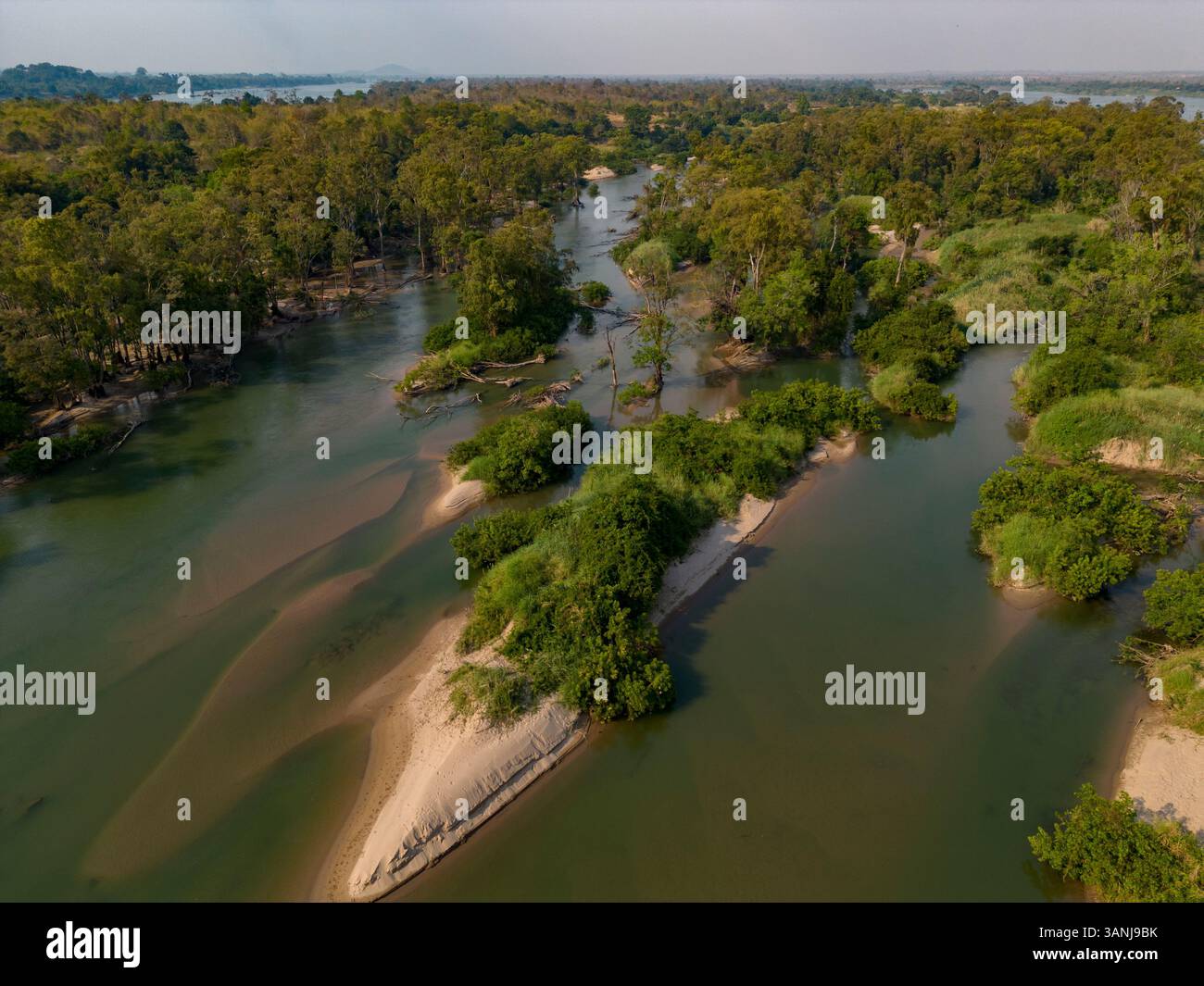 Aerial view of serene Koh Han Island surrounded by lush greenery and ...