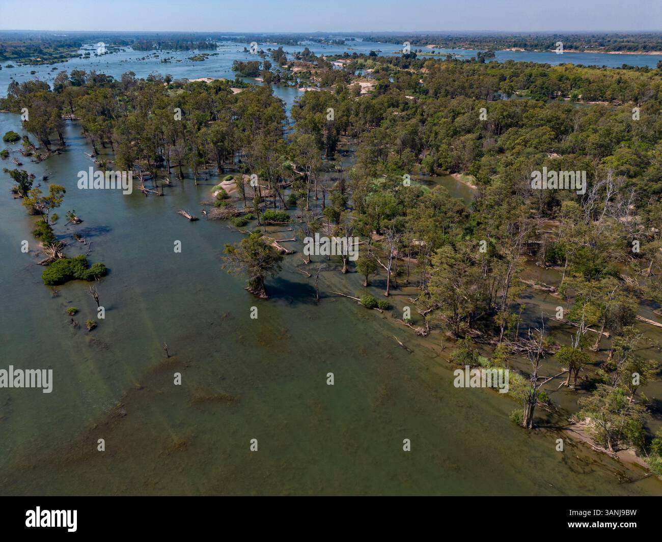 Aerial view of Koh Han Island with lush greenery and serene wetlands ...