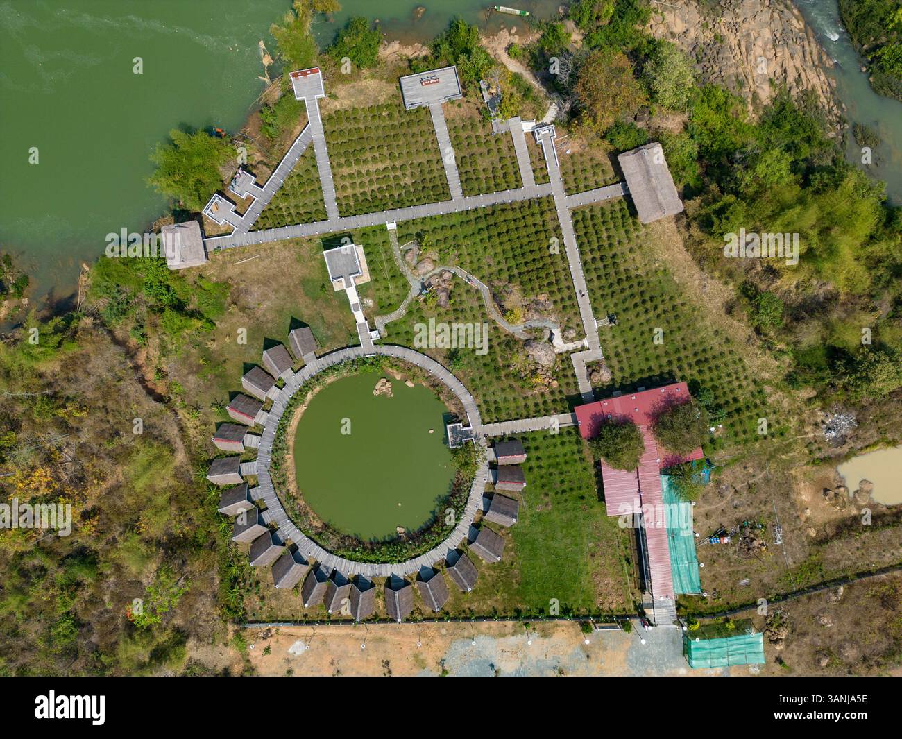 Aerial view of srepok river restaurant surrounded by lush greenery ...