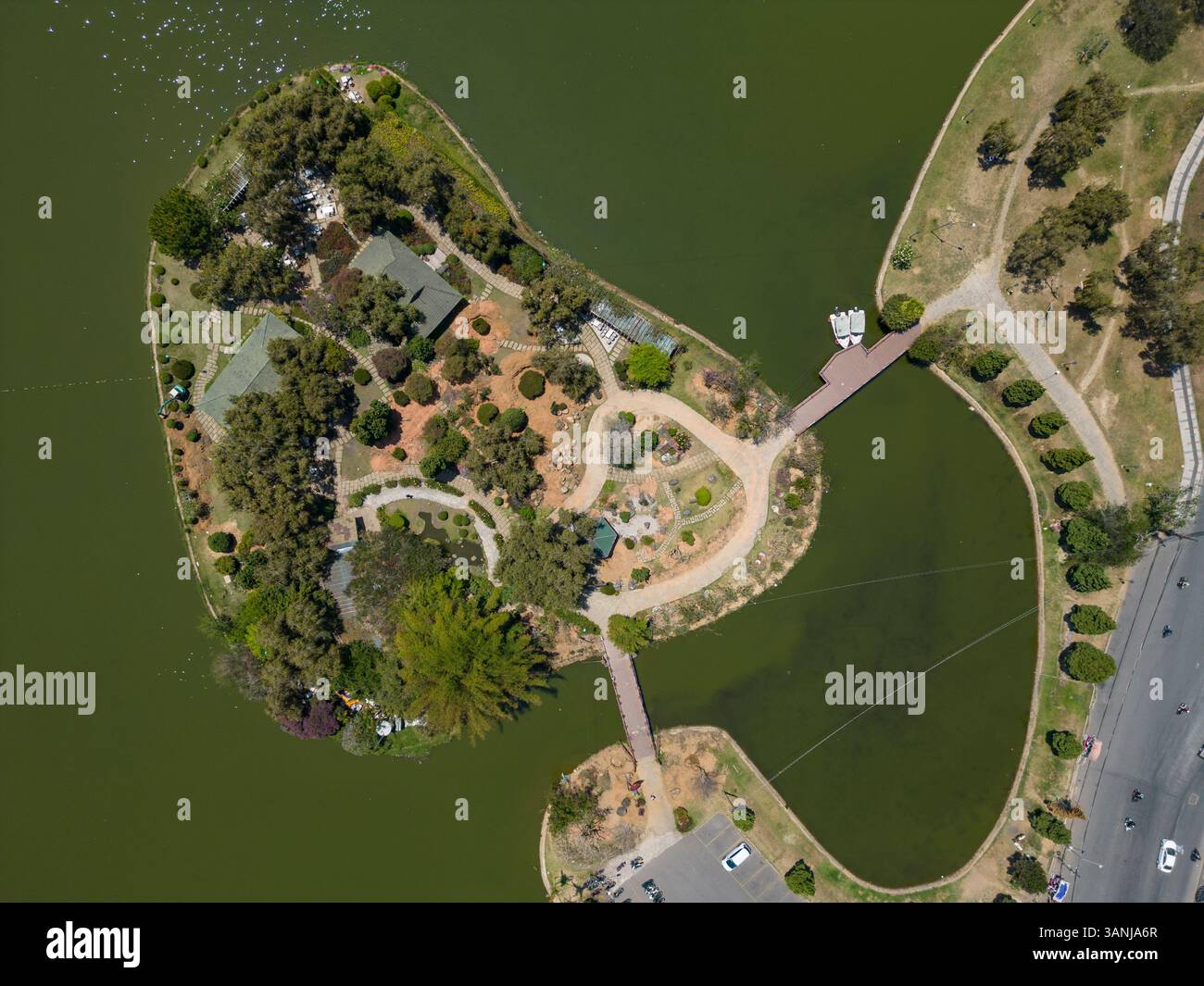 Aerial view of a picturesque lake surrounded by lush greenery, trees ...
