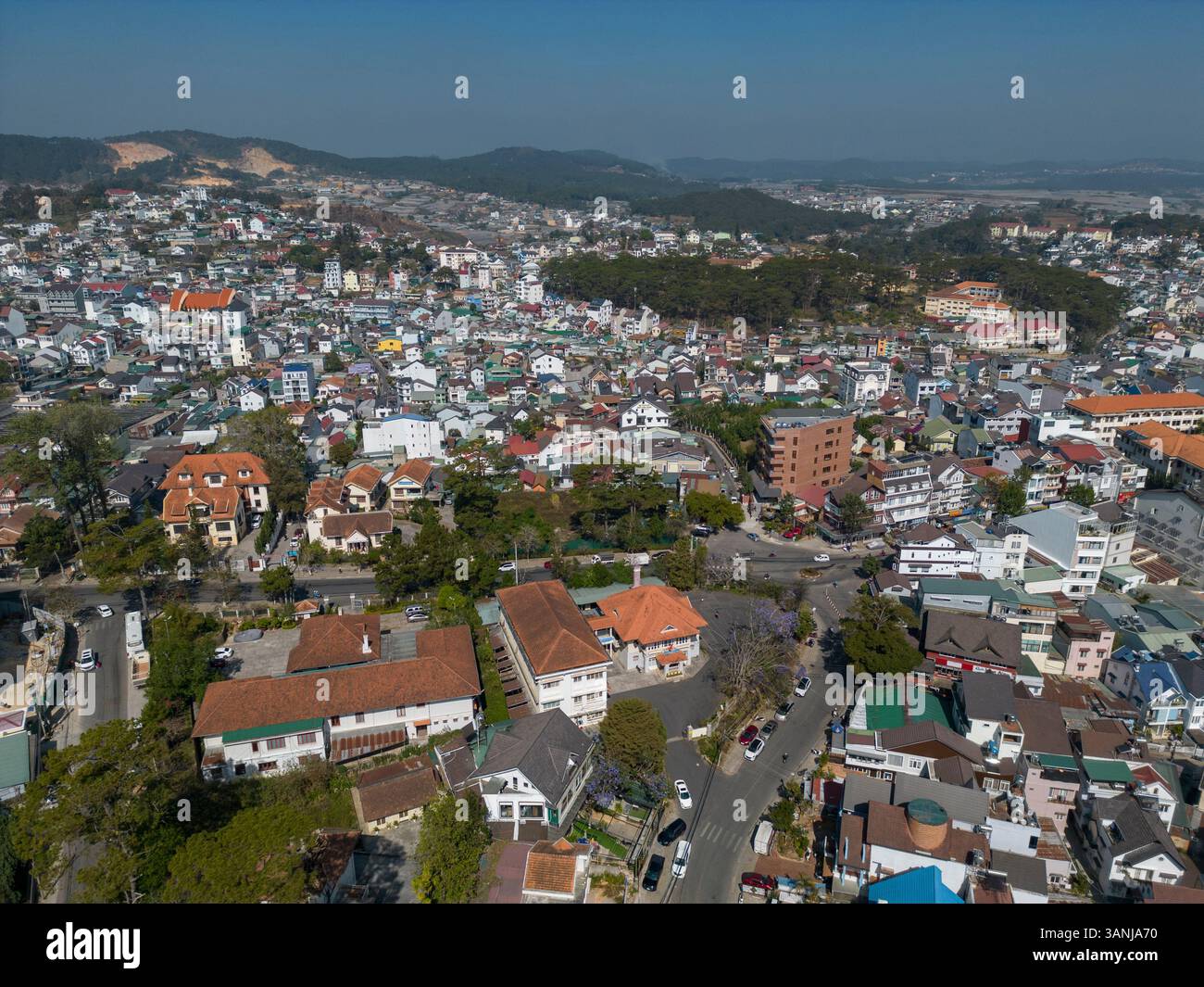 Aerial view of vibrant cityscape with dense residential buildings and ...