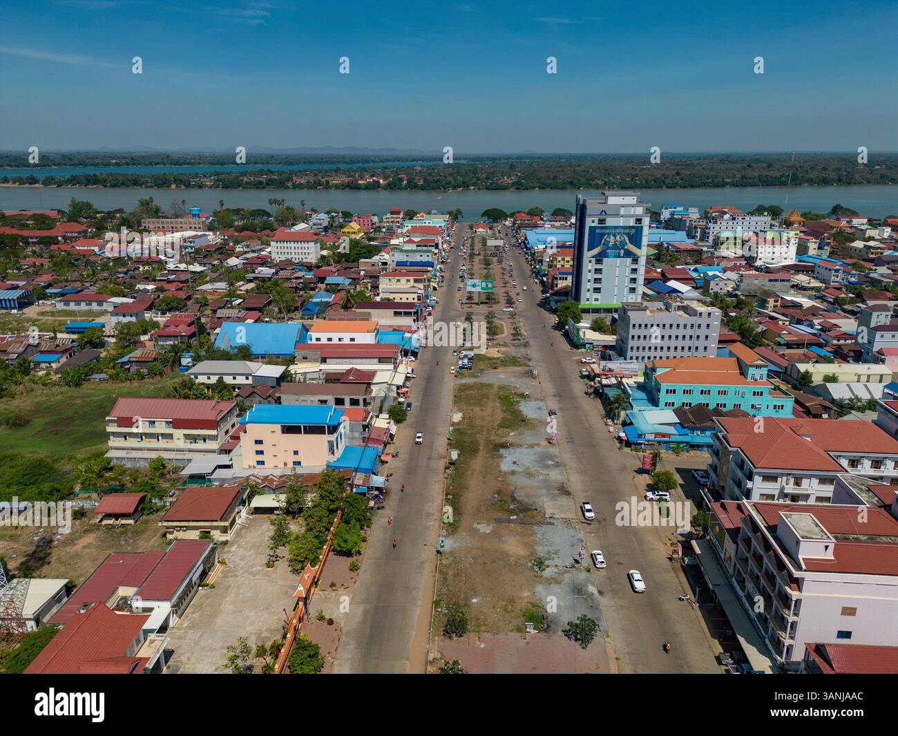 Aerial view of urban skyline with modern and traditional buildings alongside a river, Stung ...