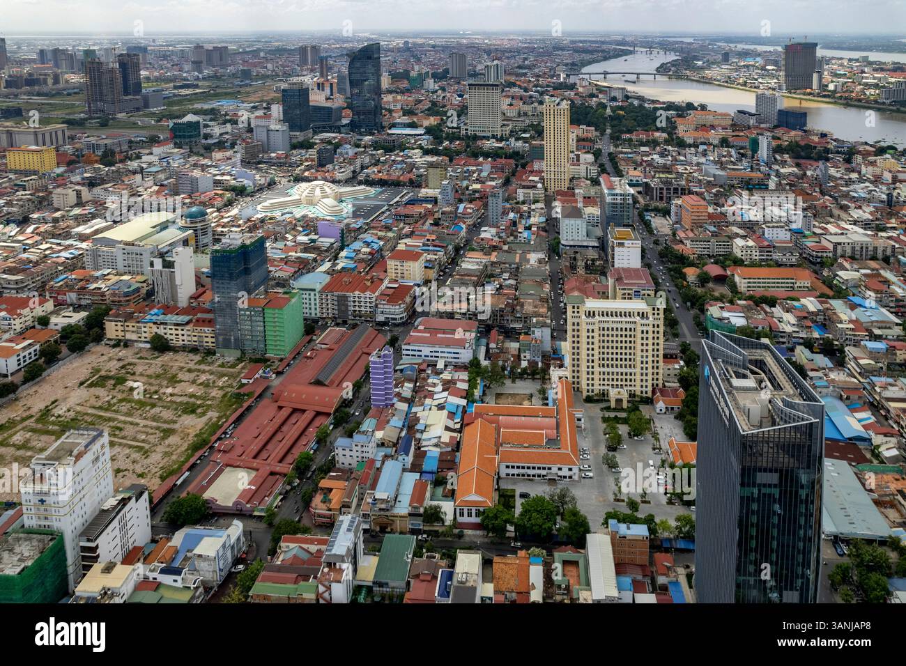 Aerial view of busy downtown cityscape with modern buildings and river ...