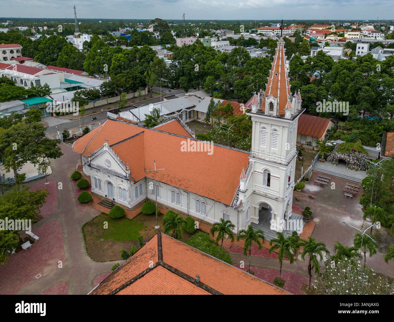 Aerial view of a picturesque church with a tall spire surrounded by ...