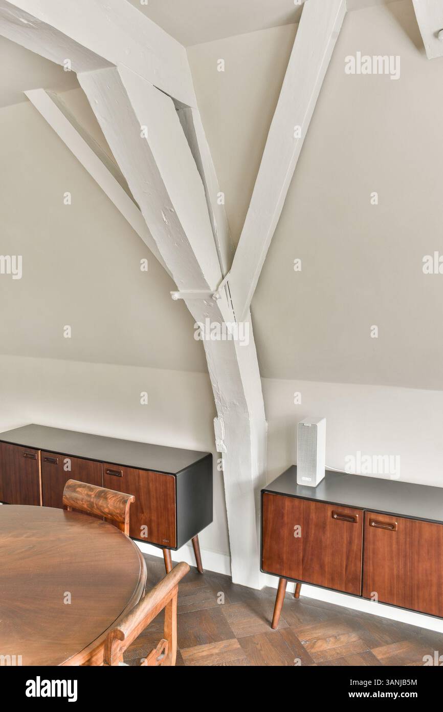 This image showcases a contemporary interior featuring striking architectural elements and a ...