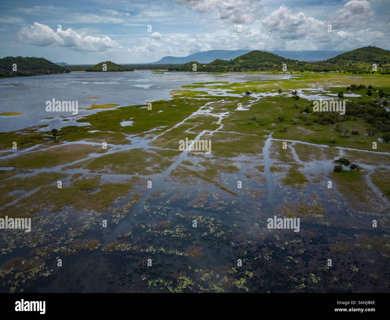 Aerial view of the Secret lake surrounded by green nature in Kampot ...