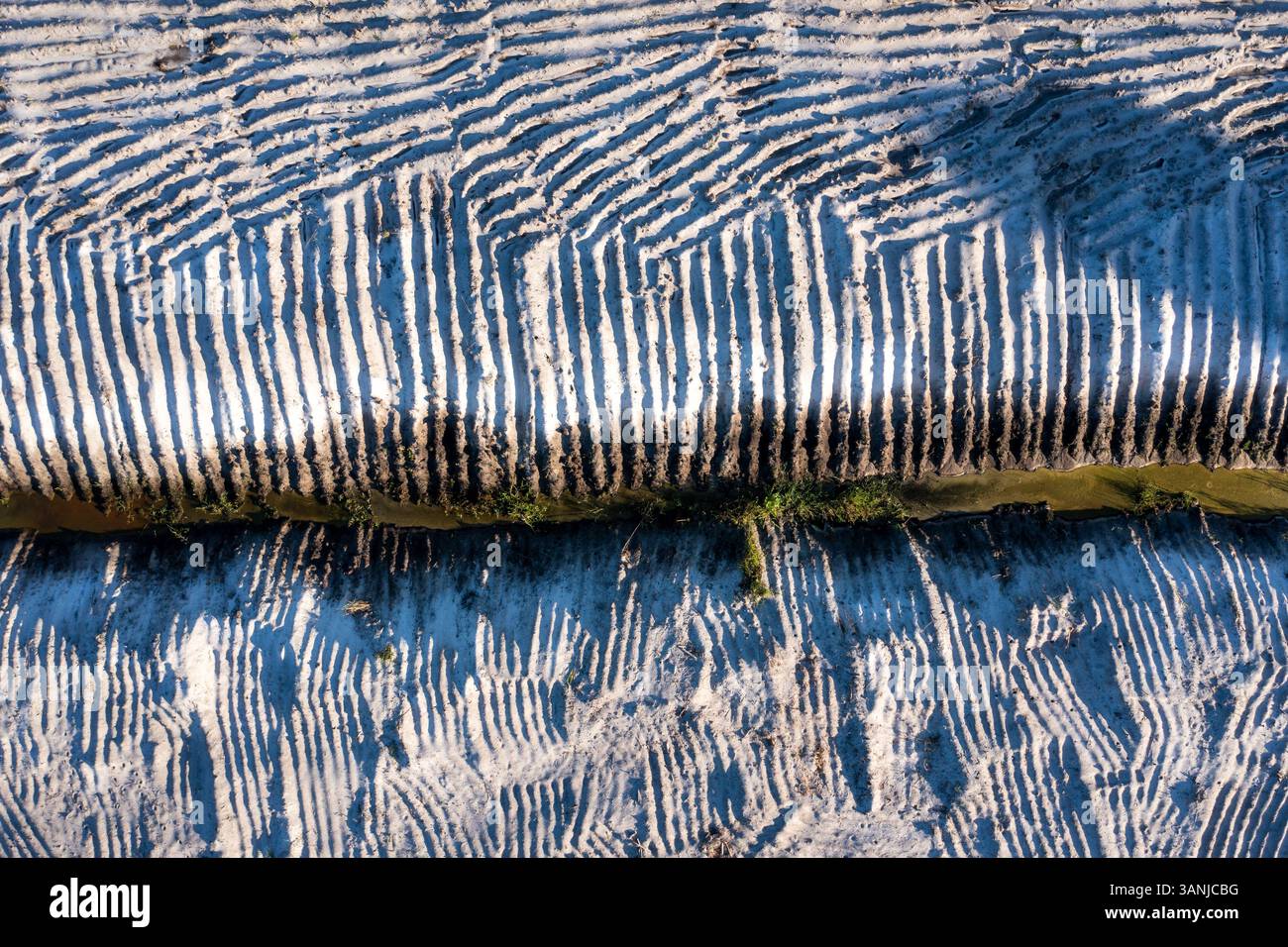 Aerial view of textured sandy landscape with unique grooves and ...