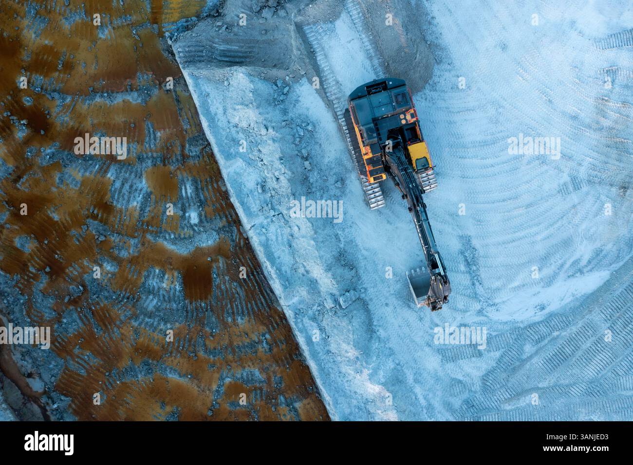 Aerial view of the industrial mining site with heavy machinery and ...