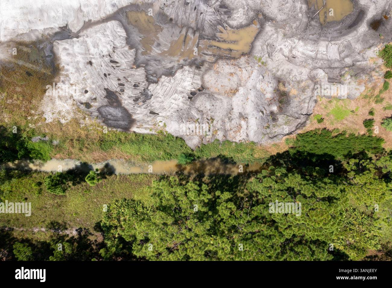 Aerial view of the industrial quarry landscape with natural greenery ...