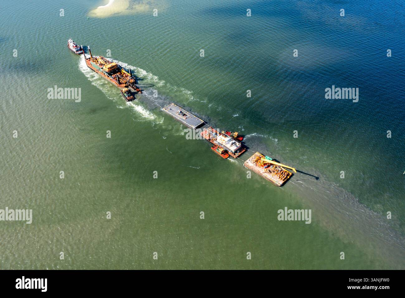 Aerial view of tugboats freeing grounded barges in Indian River Lagoon ...
