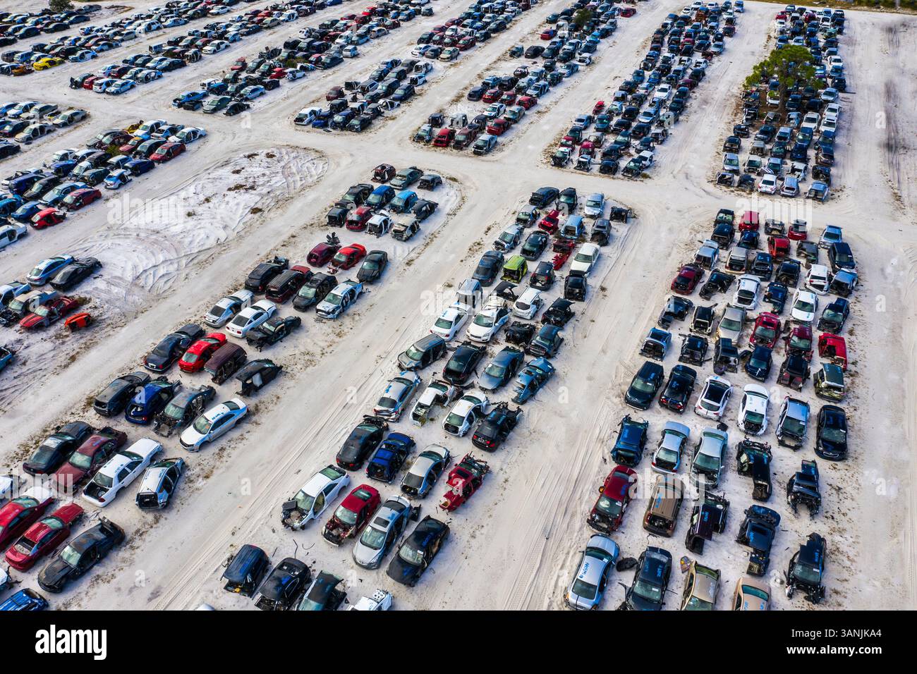 Aerial view of many vehicles in a car park junkyard, Palmdale, Florida ...