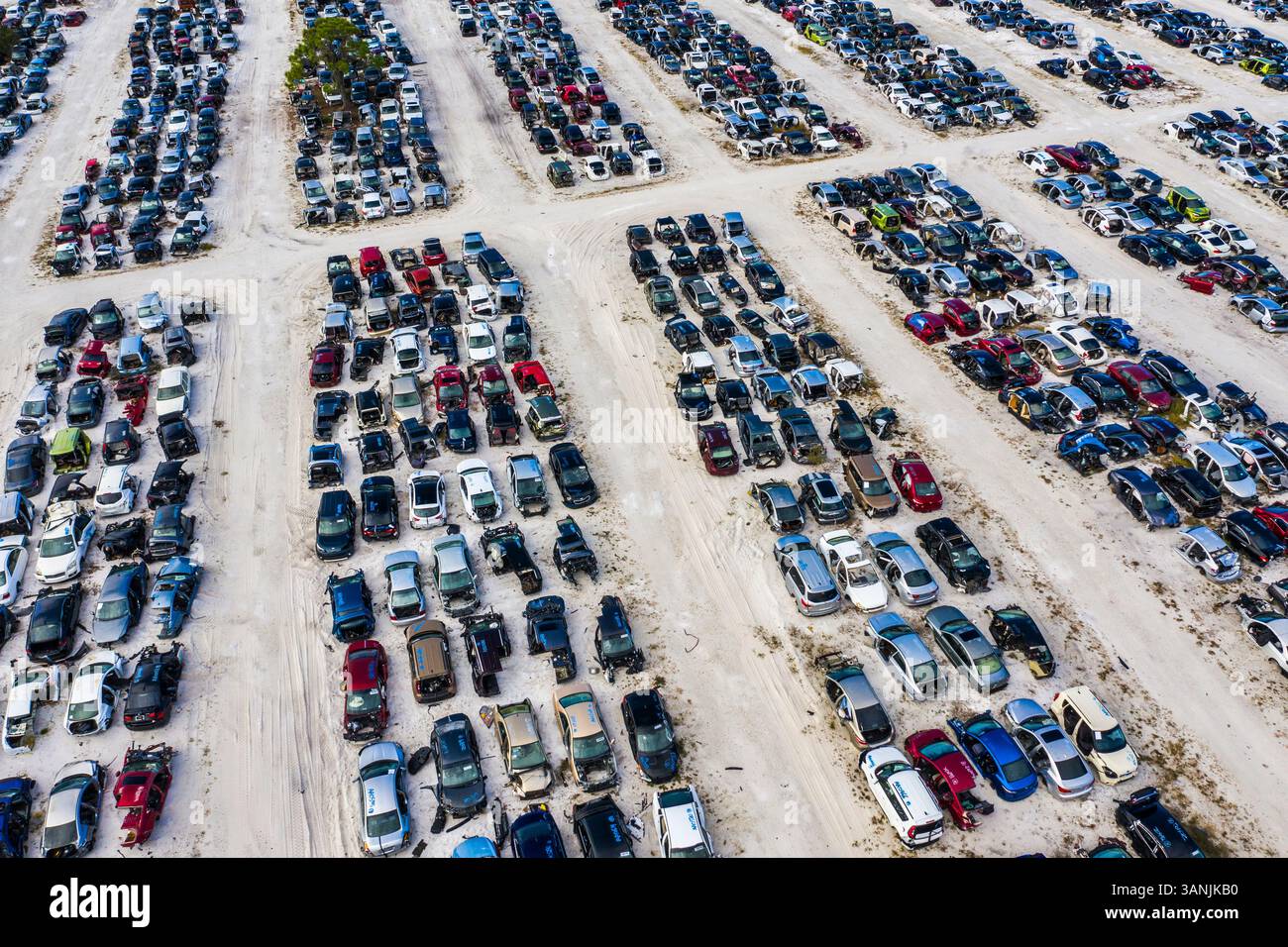Aerial view of many vehicles in a car park junkyard, Palmdale, Florida ...