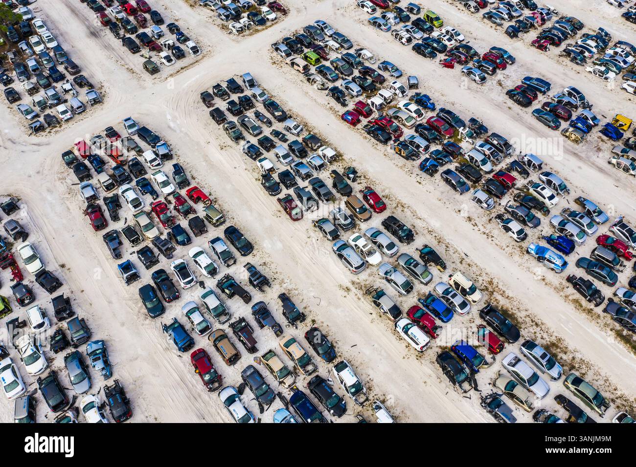 Aerial view of many vehicles in a car park junkyard, Palmdale, Florida ...