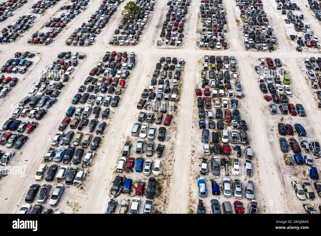 Aerial view of many vehicles in a car park junkyard, Palmdale, Florida ...