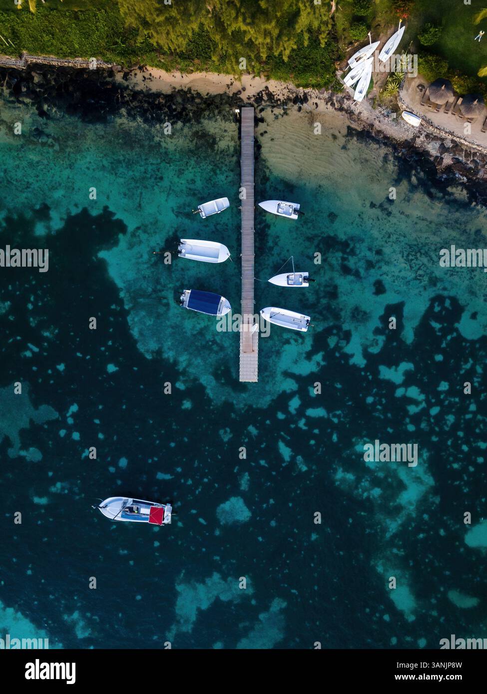 Aerial view of dock at Pointe aux Canonniers coastline and clear Indian ...