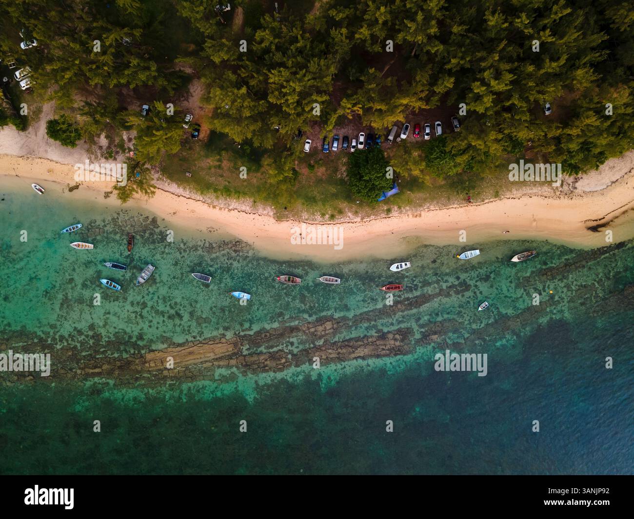 Aerial view of small fishing boats on Balaclava Public Beach at sunset ...