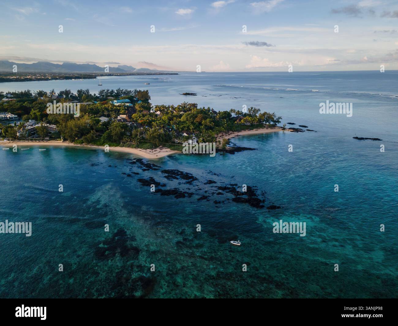 Aerial view of Pointe aux Canonniers coastline and clear Indian Ocean ...