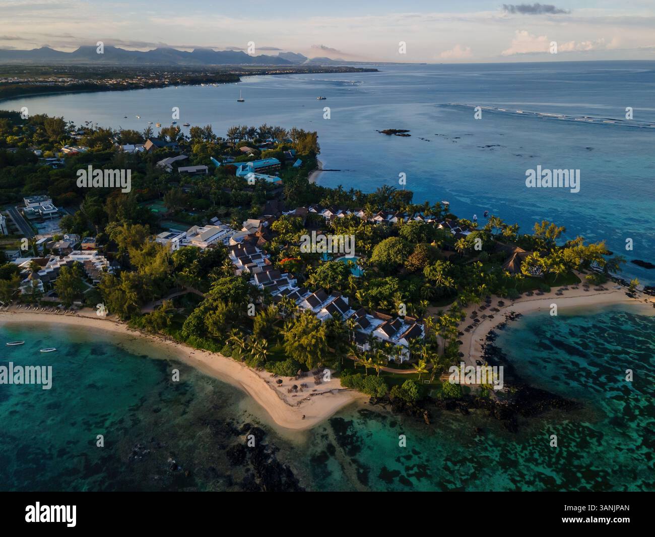 Aerial view of Pointe aux Canonniers coastline and clear Indian Ocean ...