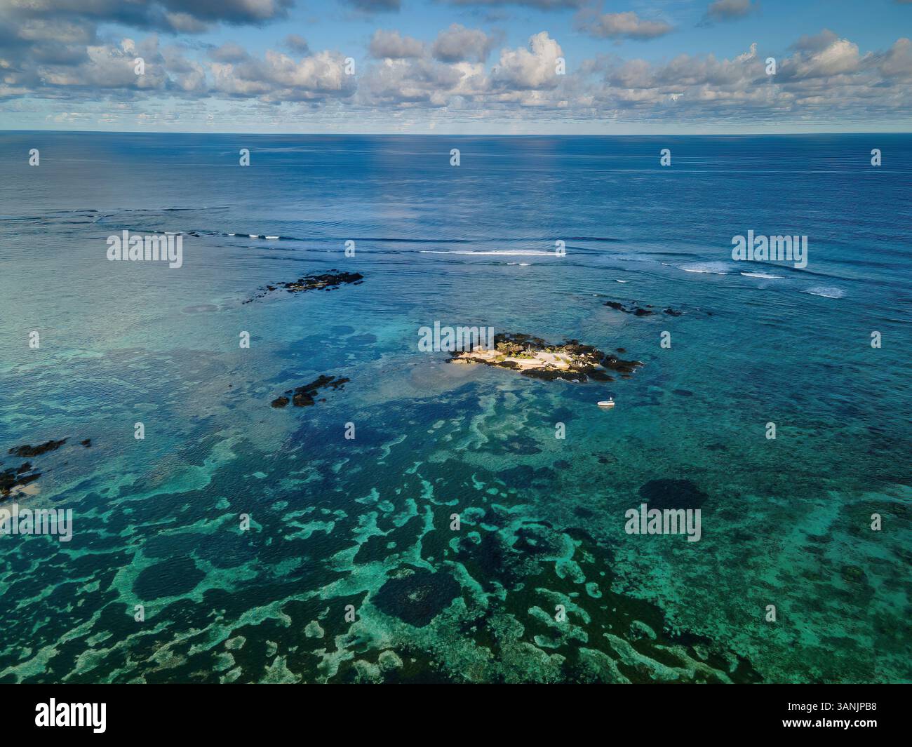 Aerial view of Pointe aux Canonniers coastline with boat and clear ...