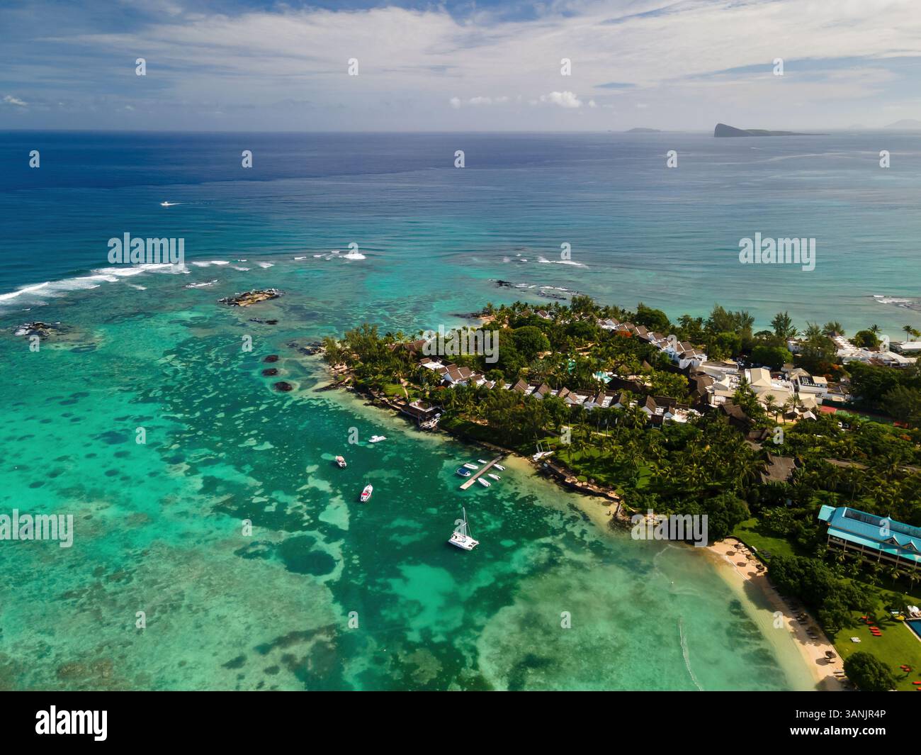 Aerial view of Pointe aux Canonniers coastline and clear Indian Ocean ...