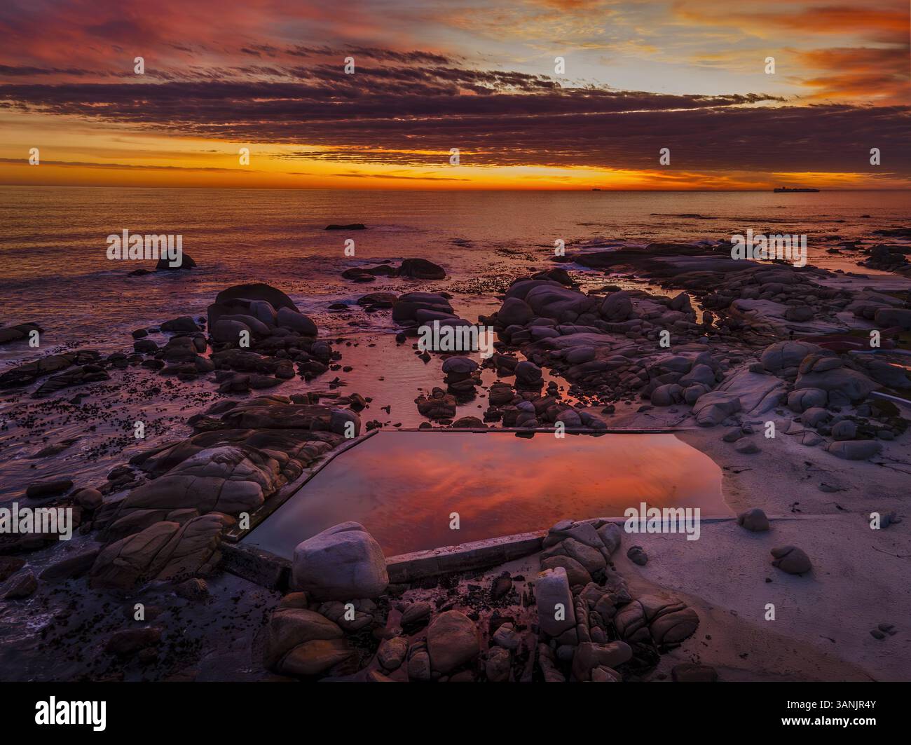 Aerial view of Maidens Cove tidal pool at sunset with Atlantic Ocean in ...