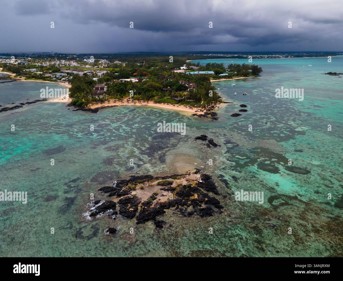 Aerial view of Pointe aux Canonniers coastline and clear Indian Ocean ...