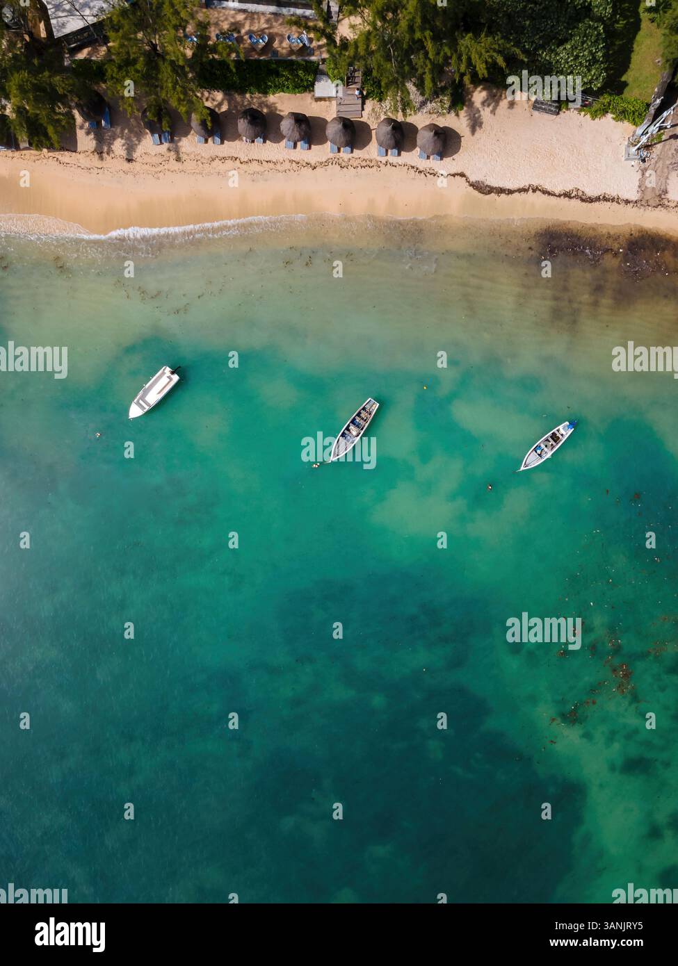 Aerial view of fishing boats on Pointe aux Canonniers coastline and ...