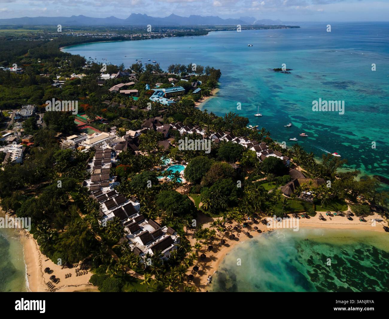 Aerial view of Pointe aux Canonniers coastline and clear Indian Ocean ...