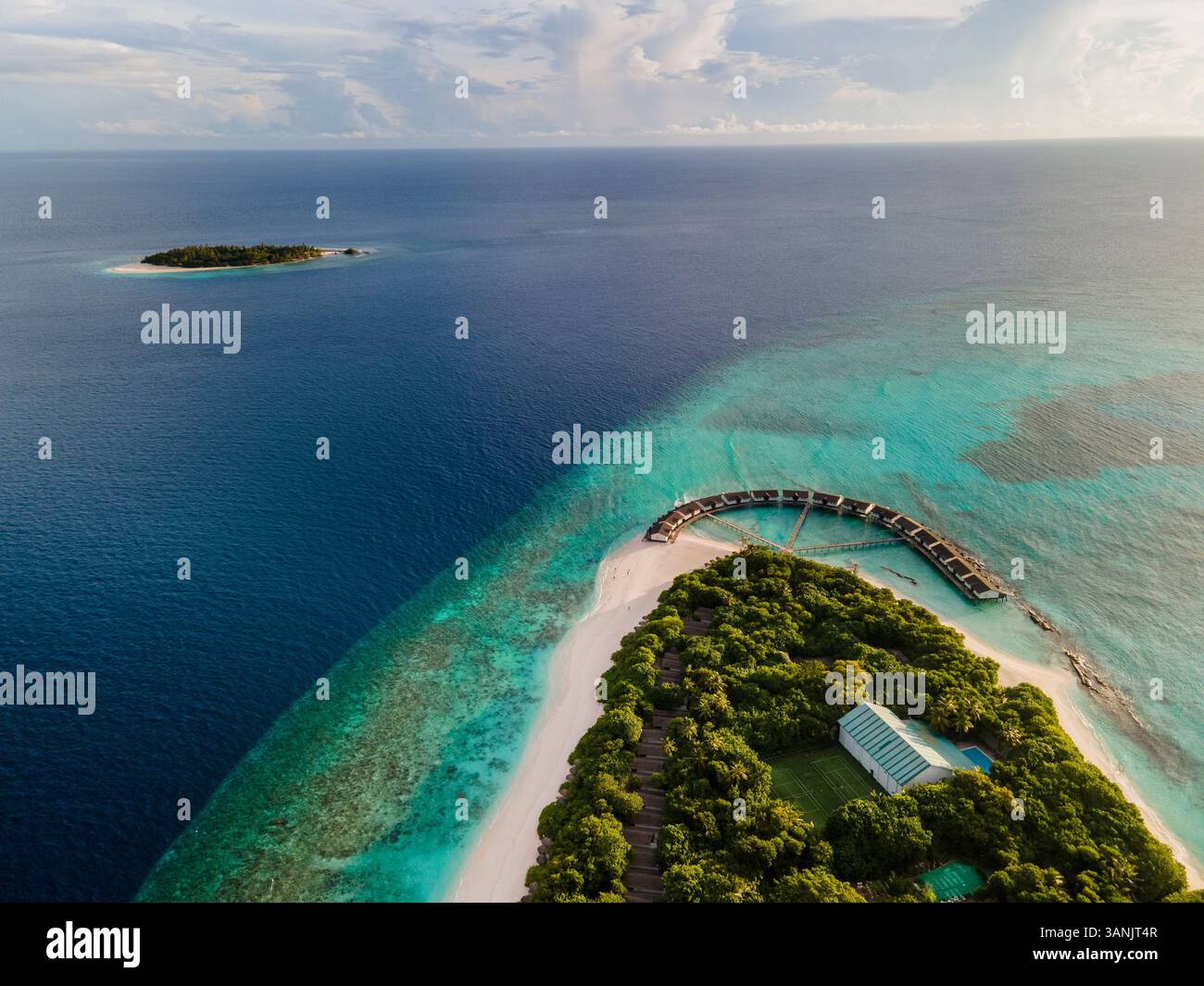 Aerial view of tropical island with water villa clear ocean, Baa Atoll ...