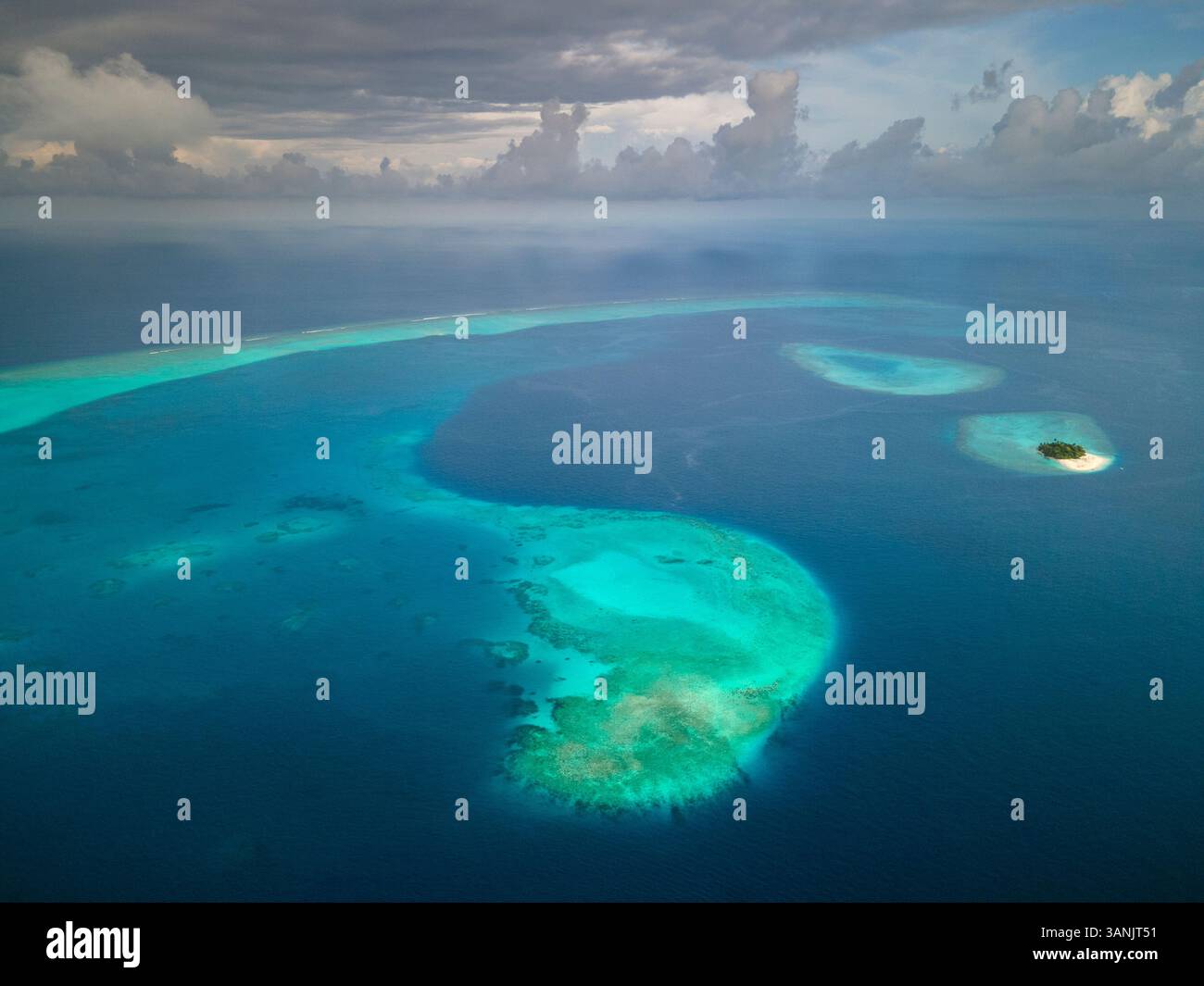 Aerial view of islands with white beach and blue ocean, Baa Atoll ...