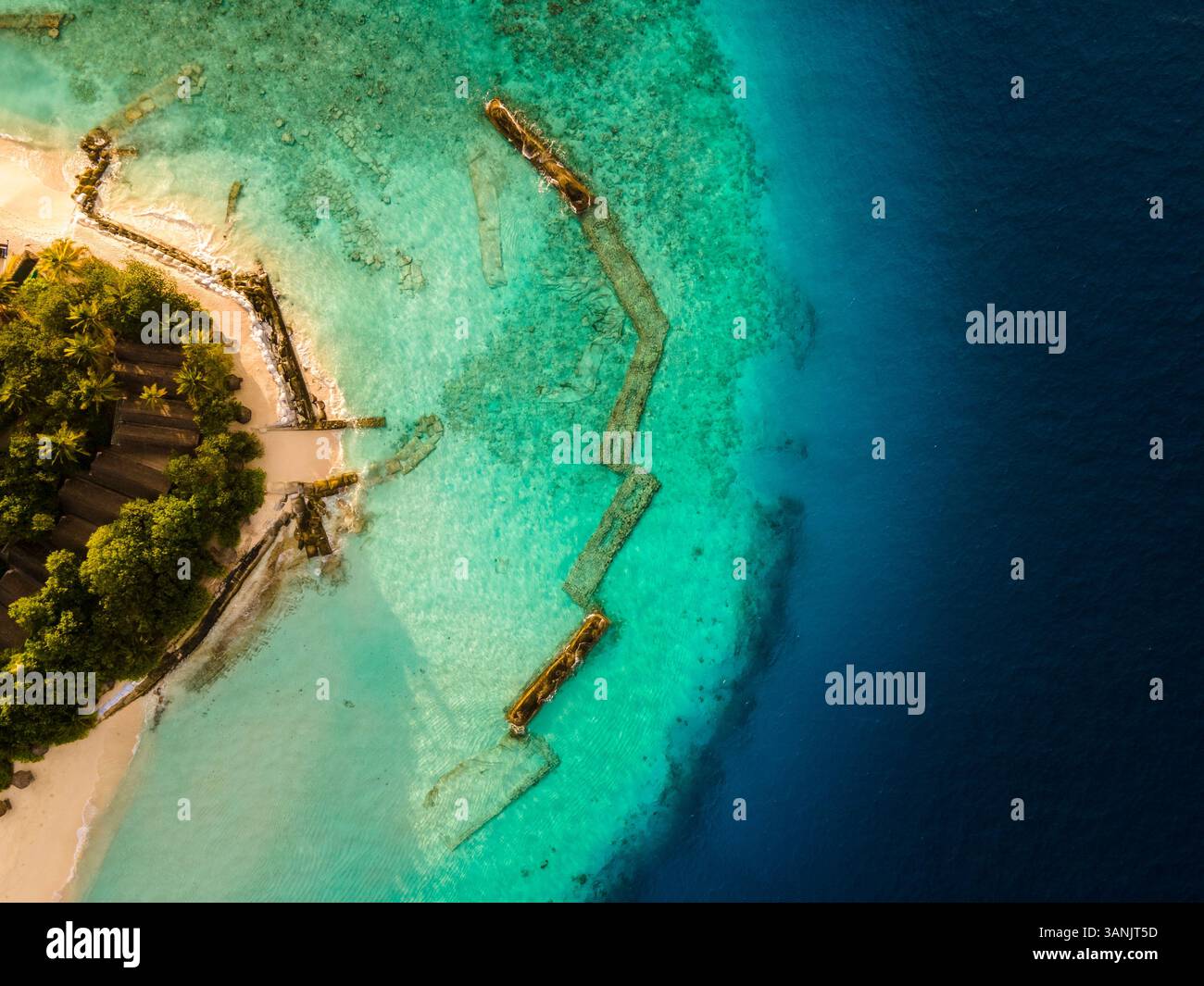 Aerial view of shipwreck along the shoreline on a tropical island, Baa ...
