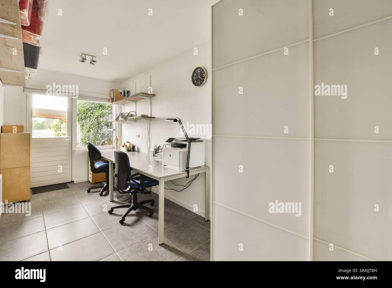 A stylish modern office space designed to maximize natural light ...