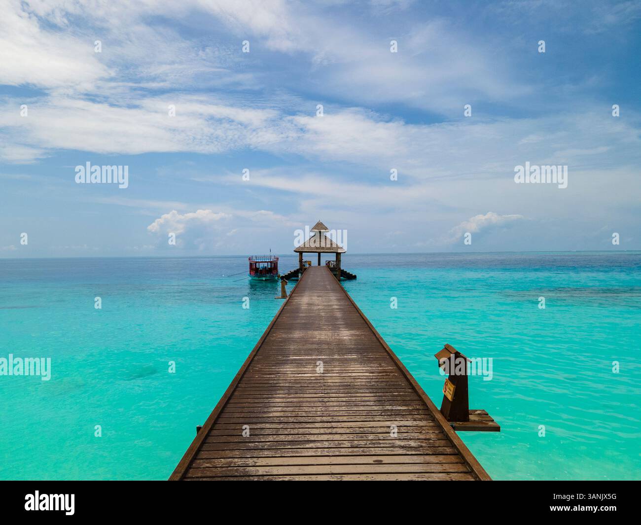 Aerial view of pier and boardwalk on crystal clear blue ocean island ...